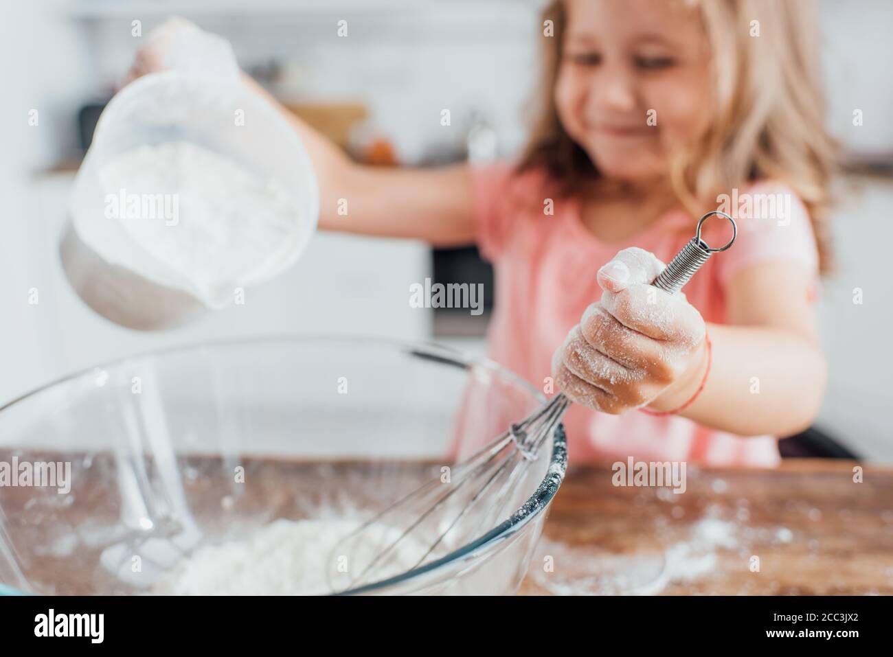 Kid pouring measuring jug hi-res stock photography and images - Alamy