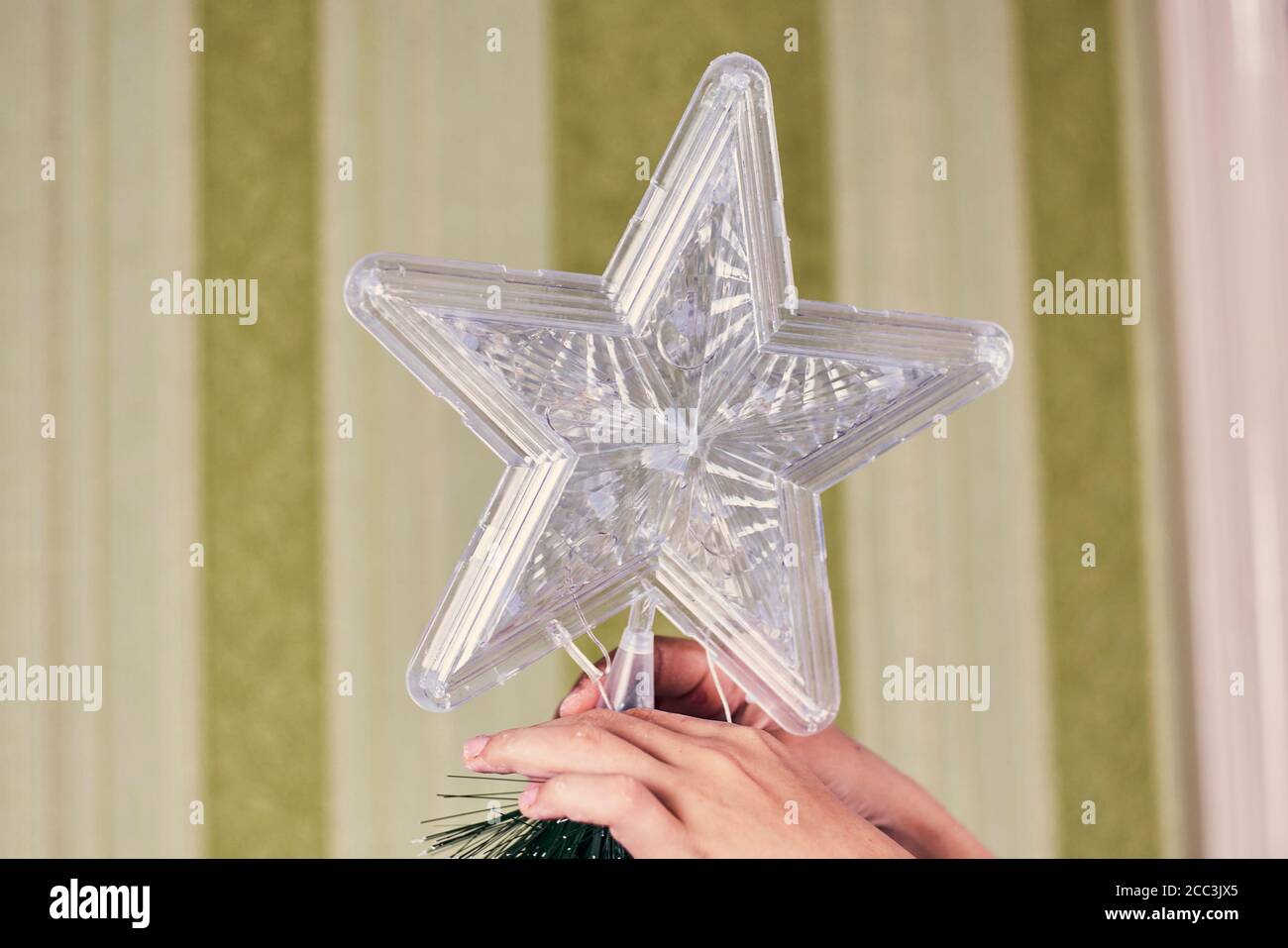 Putting star on christmas tree hi-res stock photography and images - Alamy