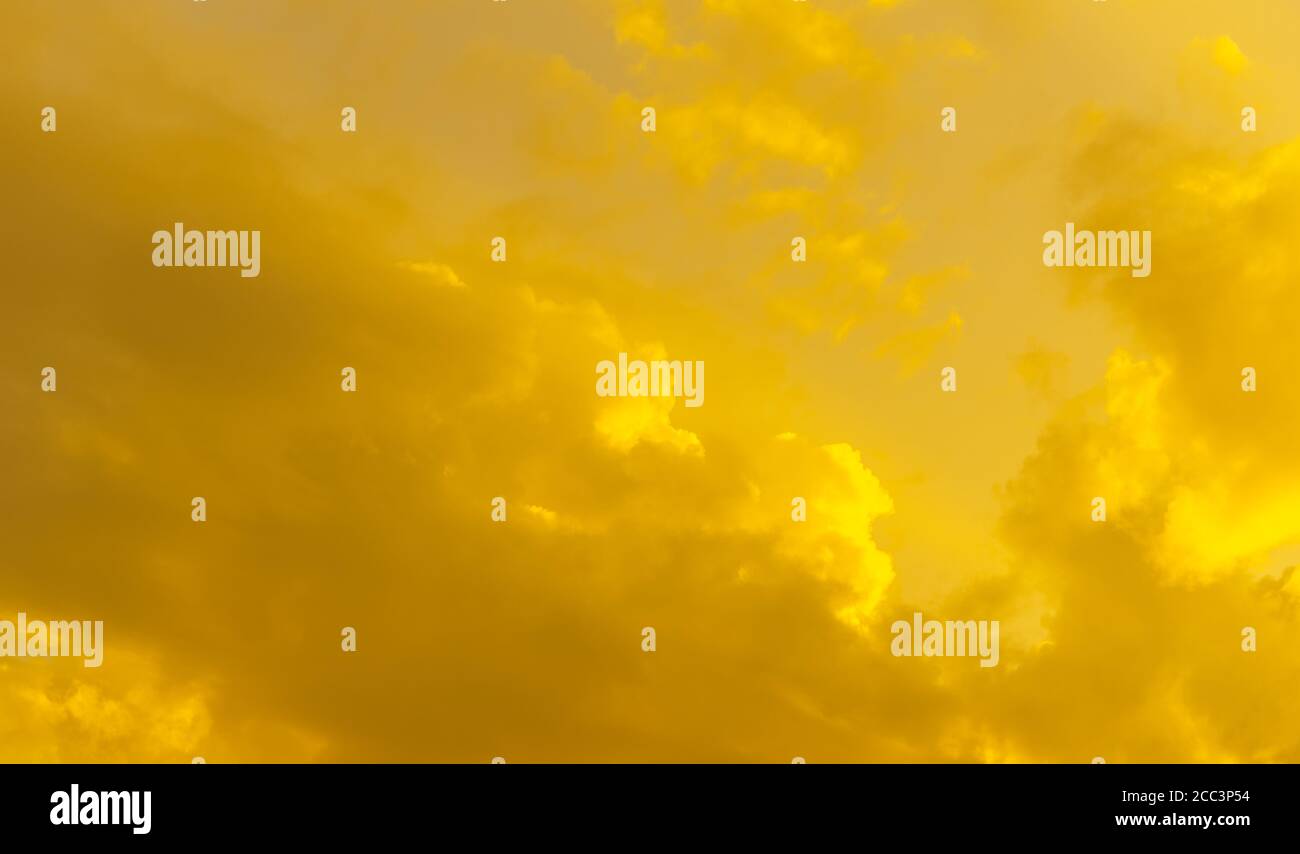 Dramatic sky. Yellowish tones and hues. Nature. End of the day, West ...