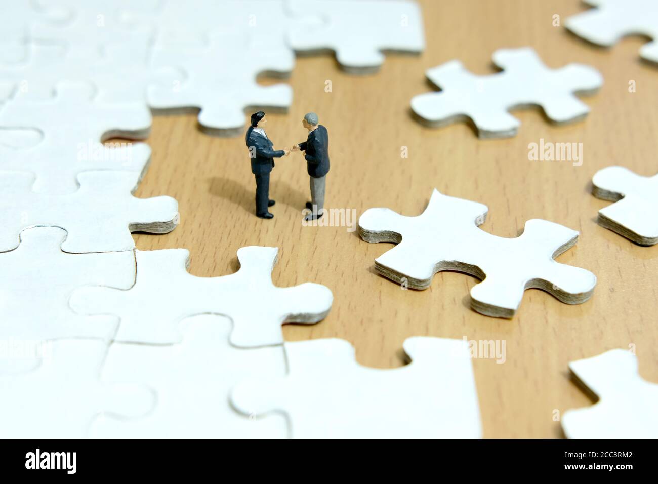 Business strategy conceptual photo - Miniature businessman make ...