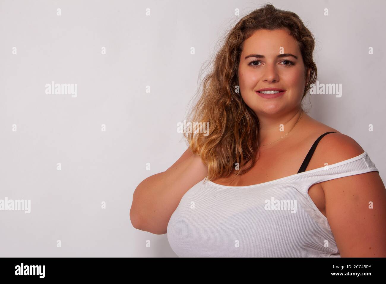 Portrait of a beautiful blonde woman with oversize Stock Photo - Alamy