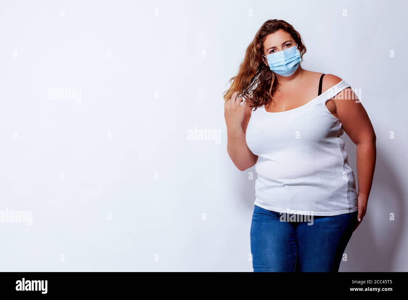 Portrait of a beautiful blonde woman with oversize and face mask Stock ...