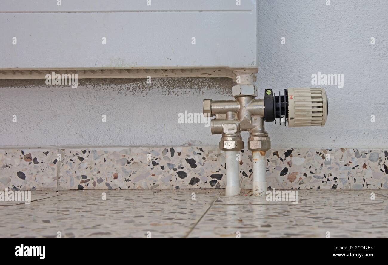Heating radiator detail with adjusting knob, low to the ground Stock ...