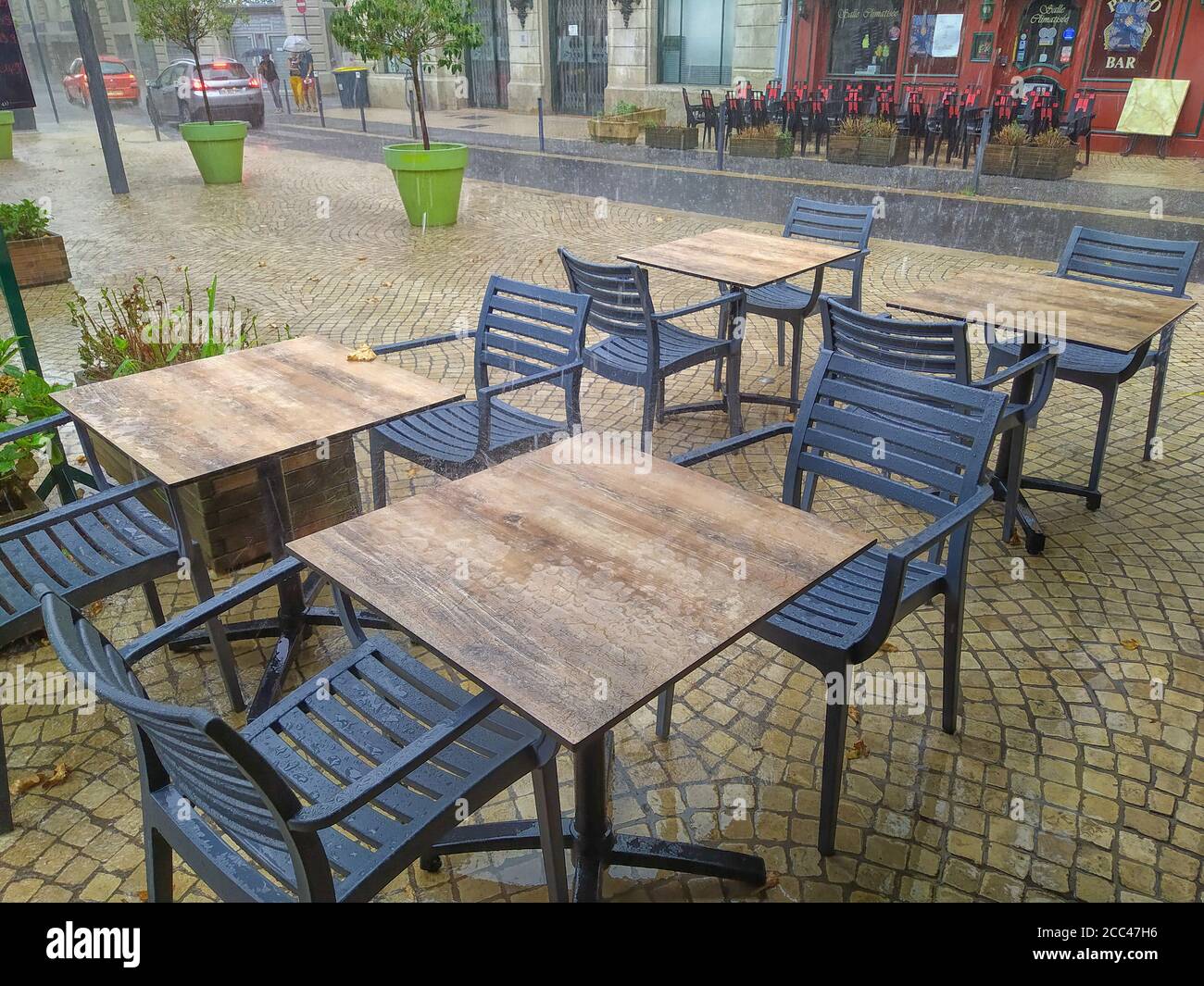 restaurant terrace in the rain Stock Photo - Alamy