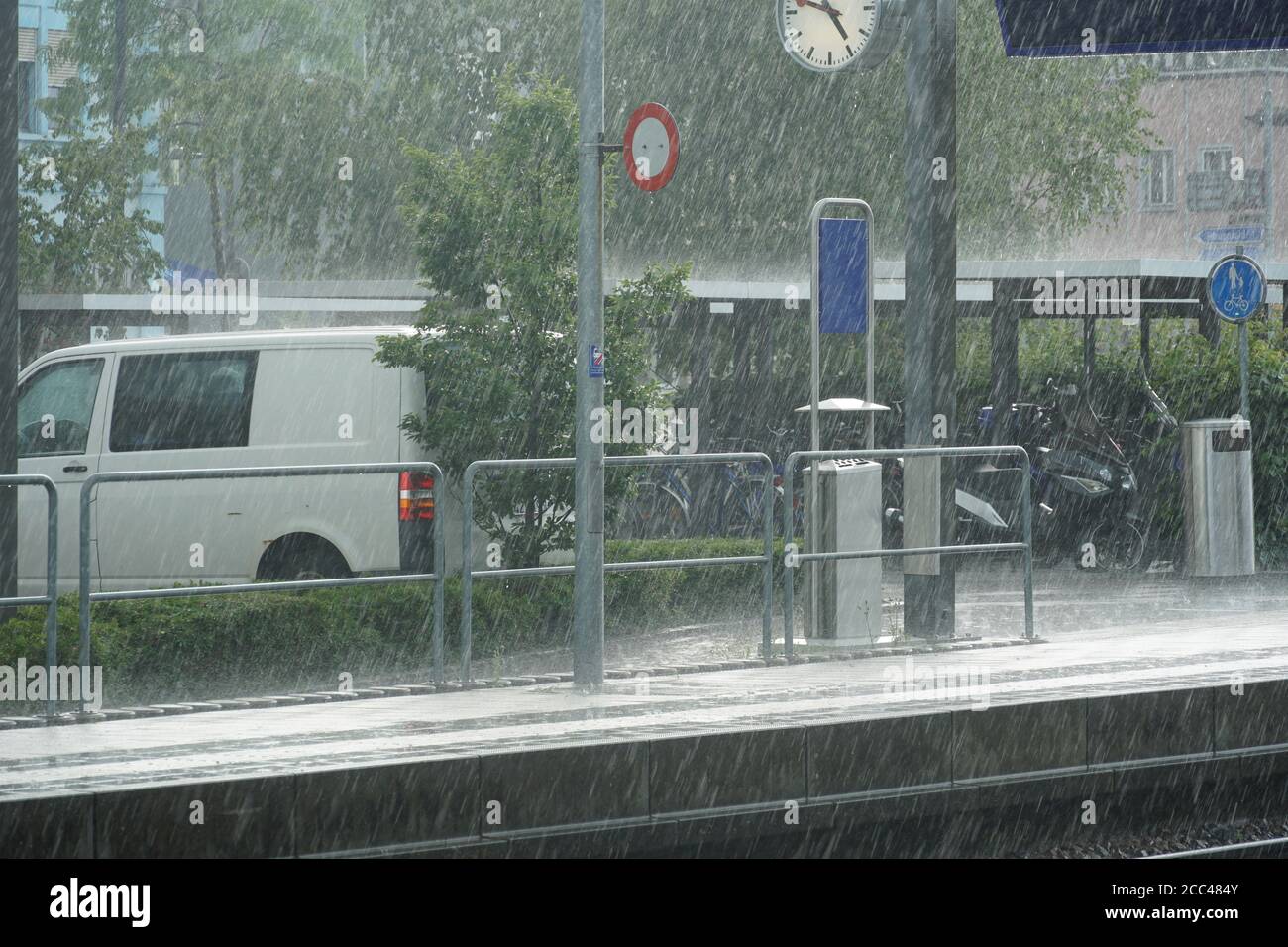 Railway station platform in the rain in Kreuzlingen, Switzerland. Heavy ...