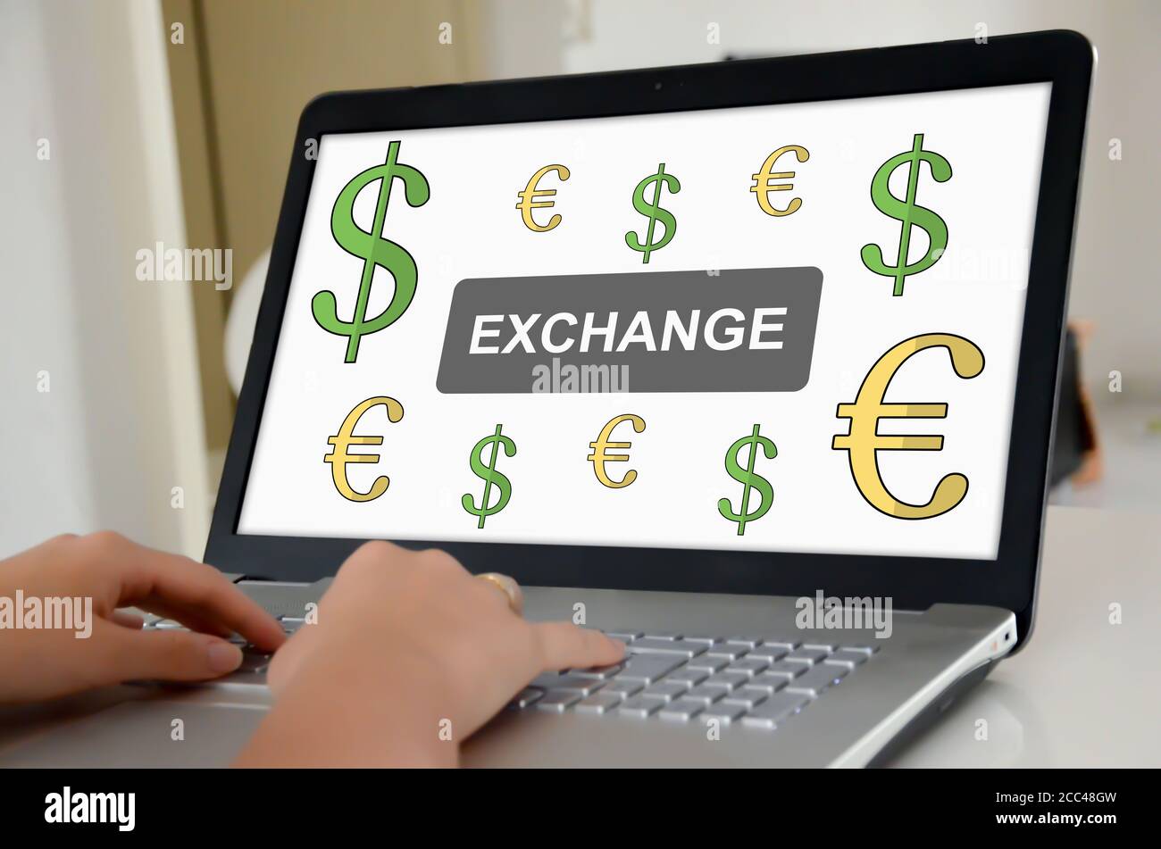 Hands on a laptop with screen showing exchange concept Stock Photo - Alamy
