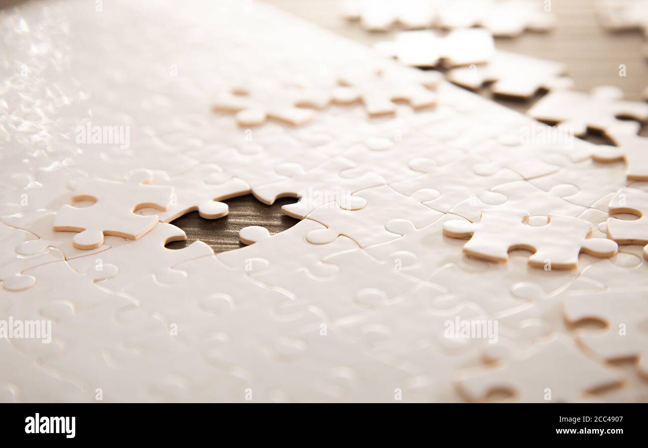 Partially completed jigsaw puzzle High Resolution Stock Photography and ...