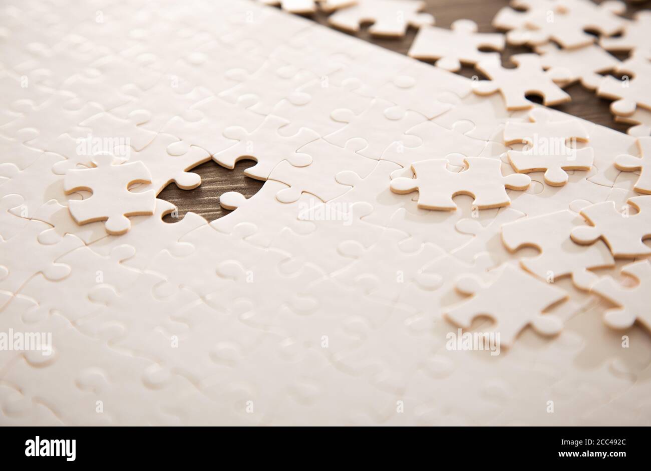 Closeup shot of a partially-completed jigsaw puzzle Stock Photo - Alamy