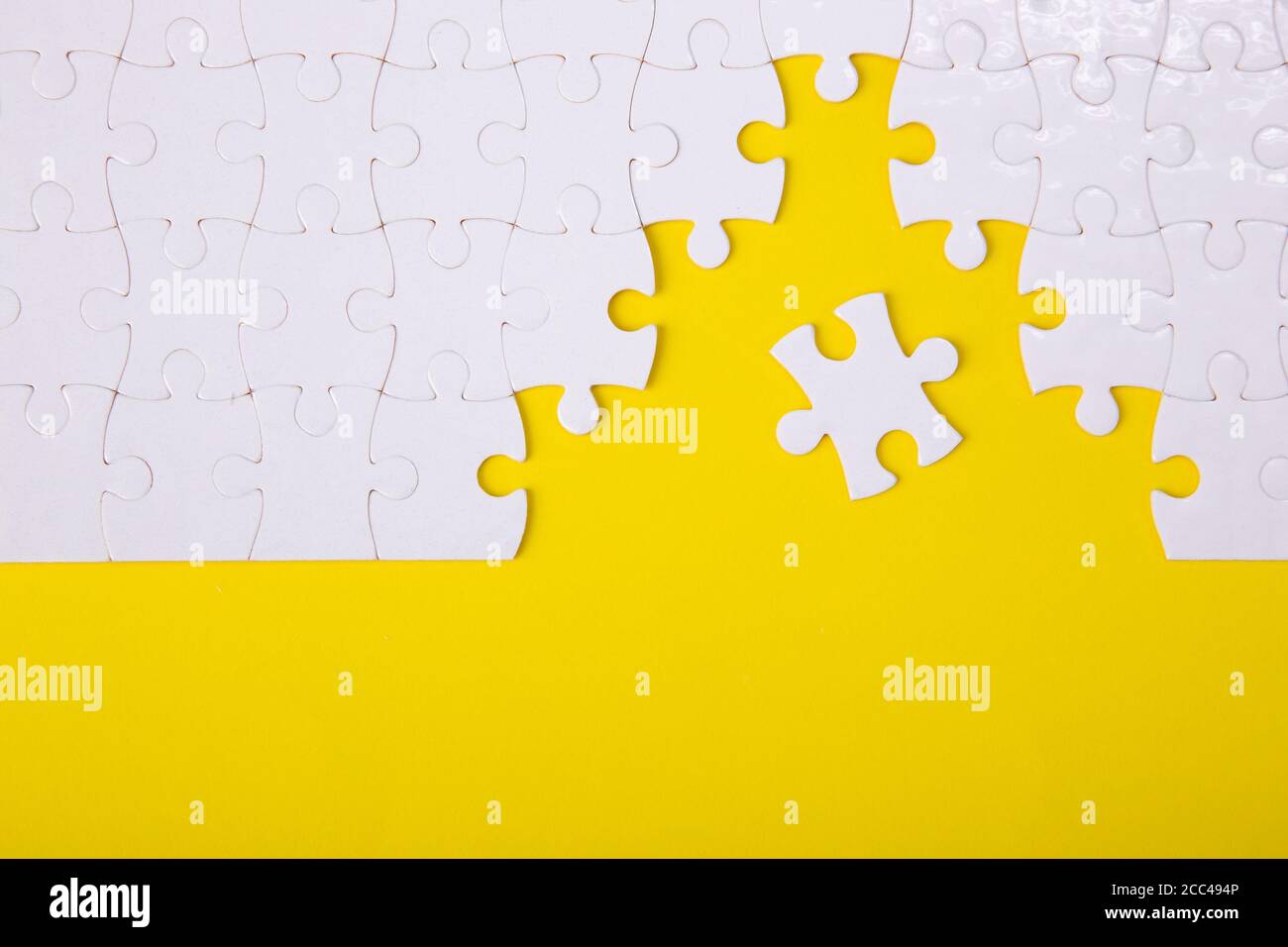 Partially completed jigsaw puzzle High Resolution Stock Photography and ...