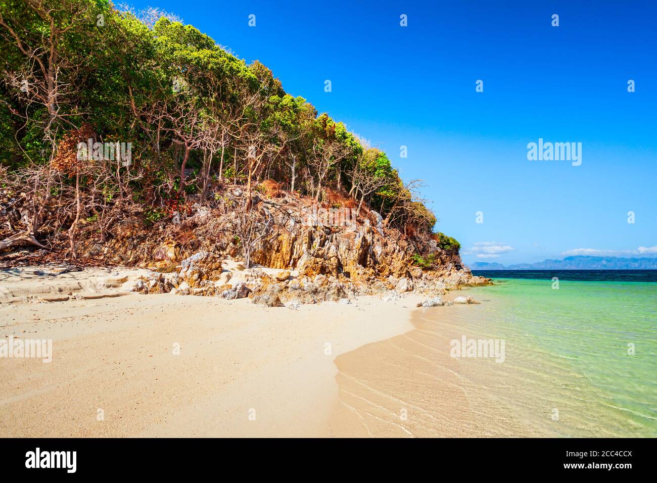 Beauty rocky beach with yellow sand and turquoise water in Busuanga ...