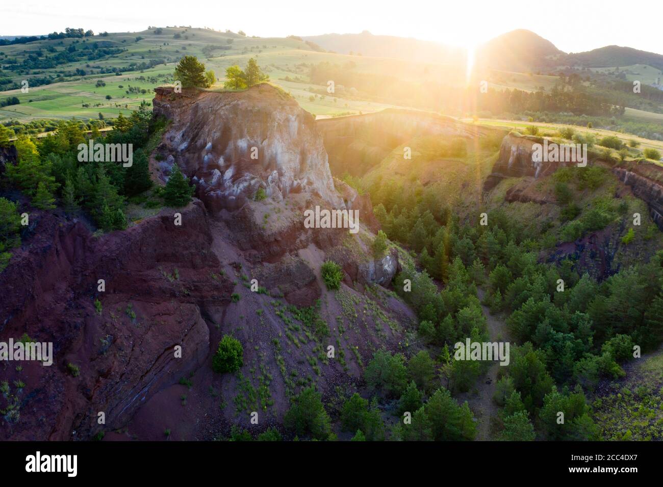 Aerial view of Racos volcanic crater in the sunrise, Brasov county ...