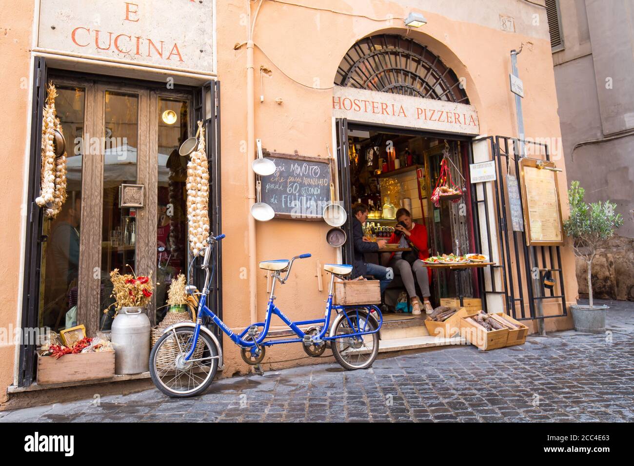 Rome, Italy - May 14, 2016: People eating traditional Italian food in a ...