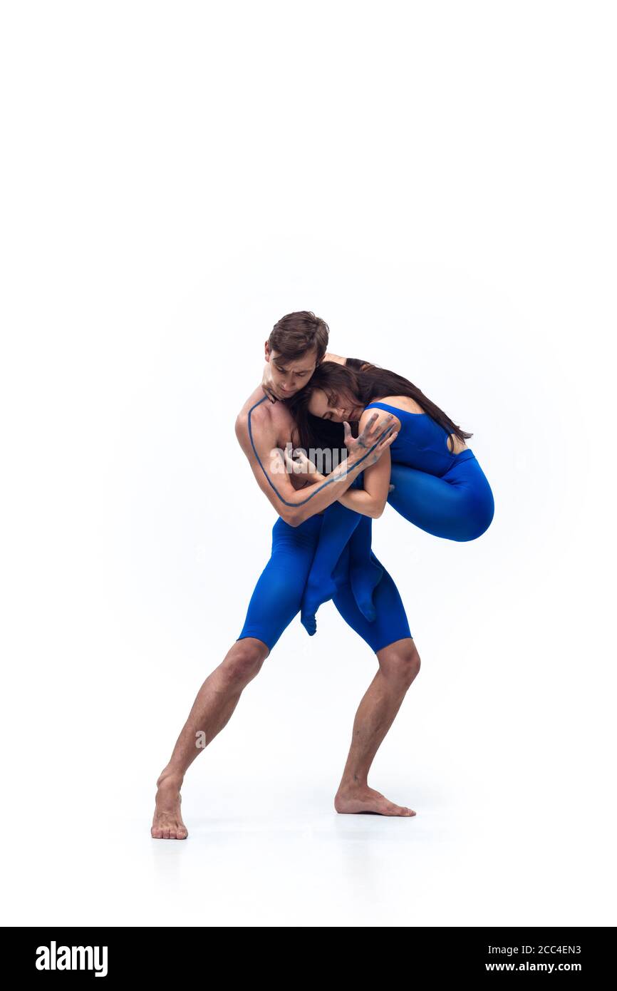 Loving arms. Couple of modern dancers, art contemp dance, blue and ...