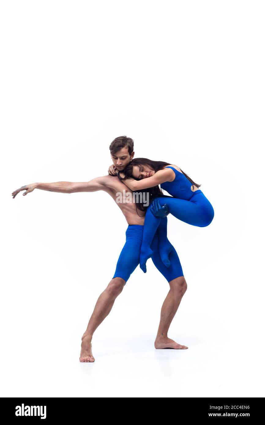 Hug. Couple of modern dancers, art contemp dance, blue and white ...