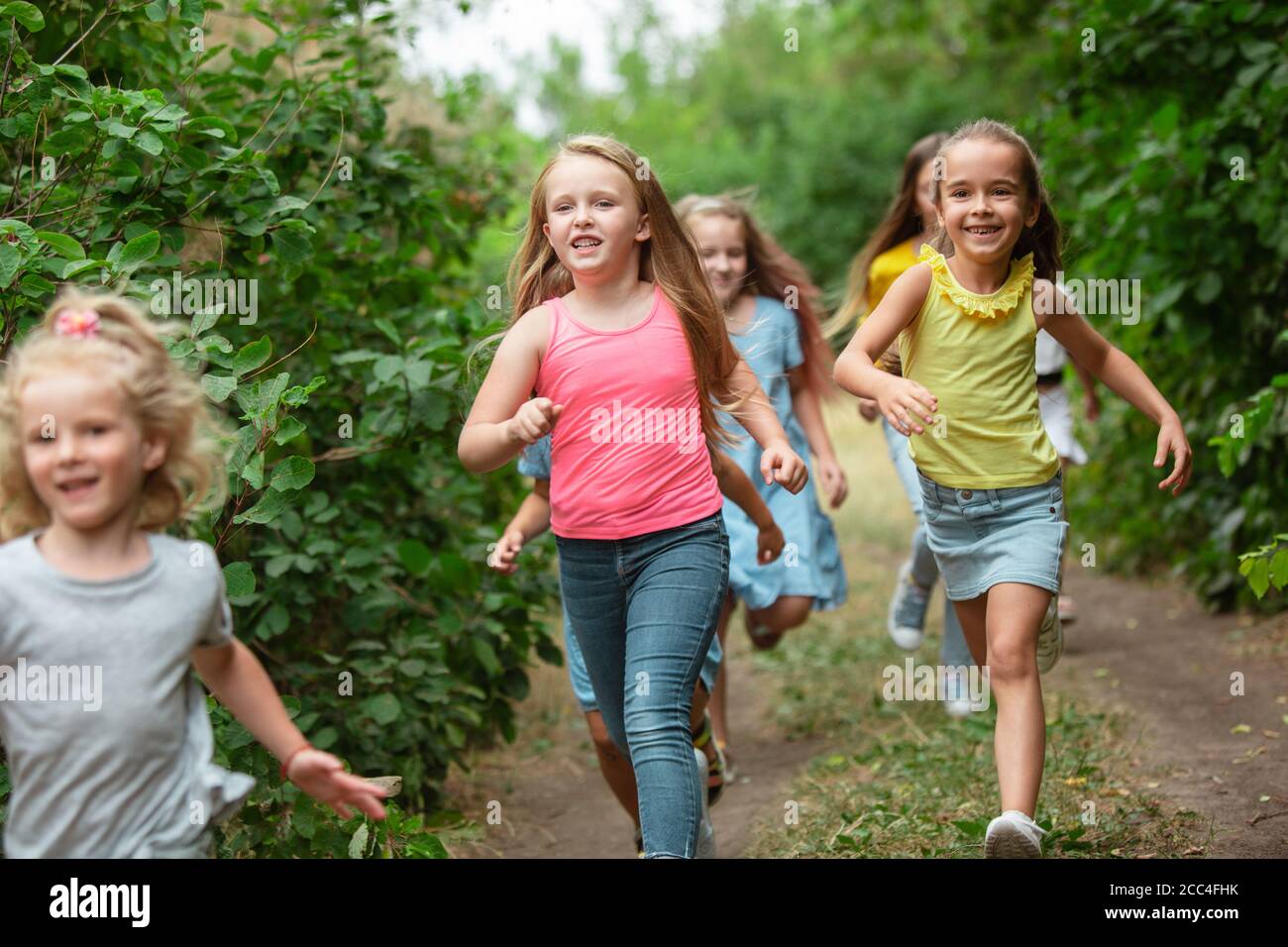 Boys running through forest hi-res stock photography and images - Alamy