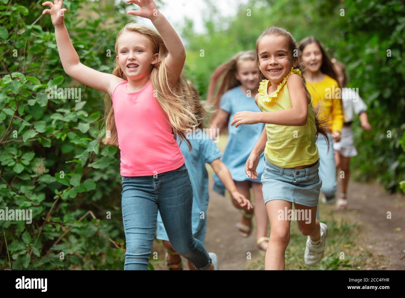 Happiness. Kids, children running on green forest. Cheerful and happy ...