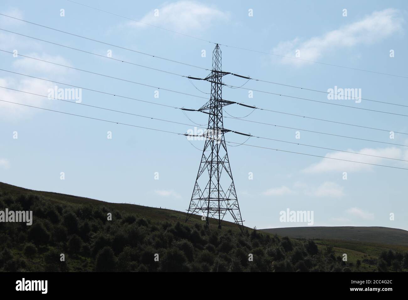 electric pylon and power lines against a blue sky with copy space Stock ...