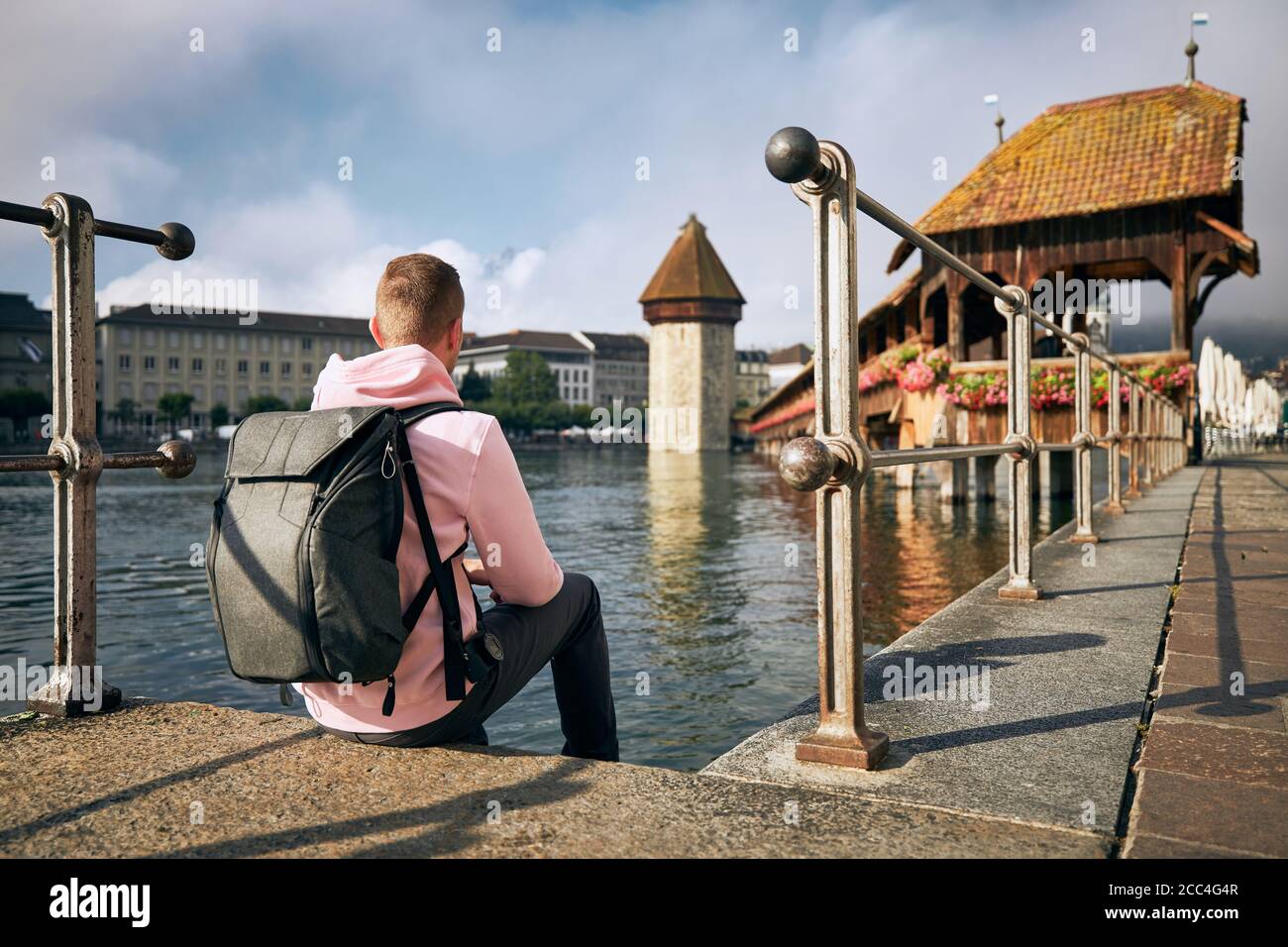 Man sitting on bridge in hi-res stock photography and images - Alamy