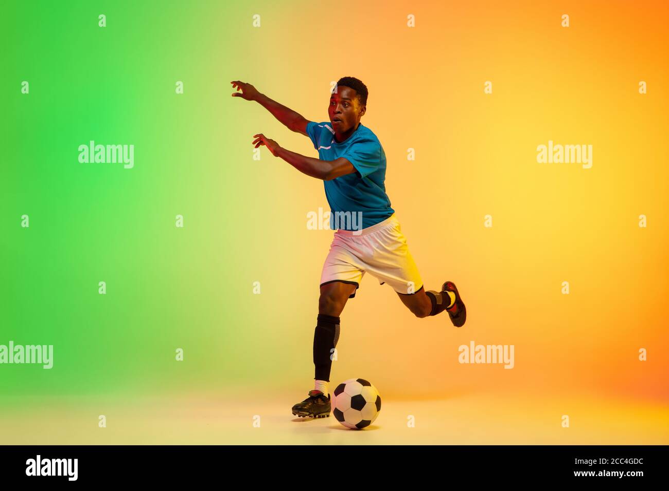 Leader. African-american male soccer, football player training in ...