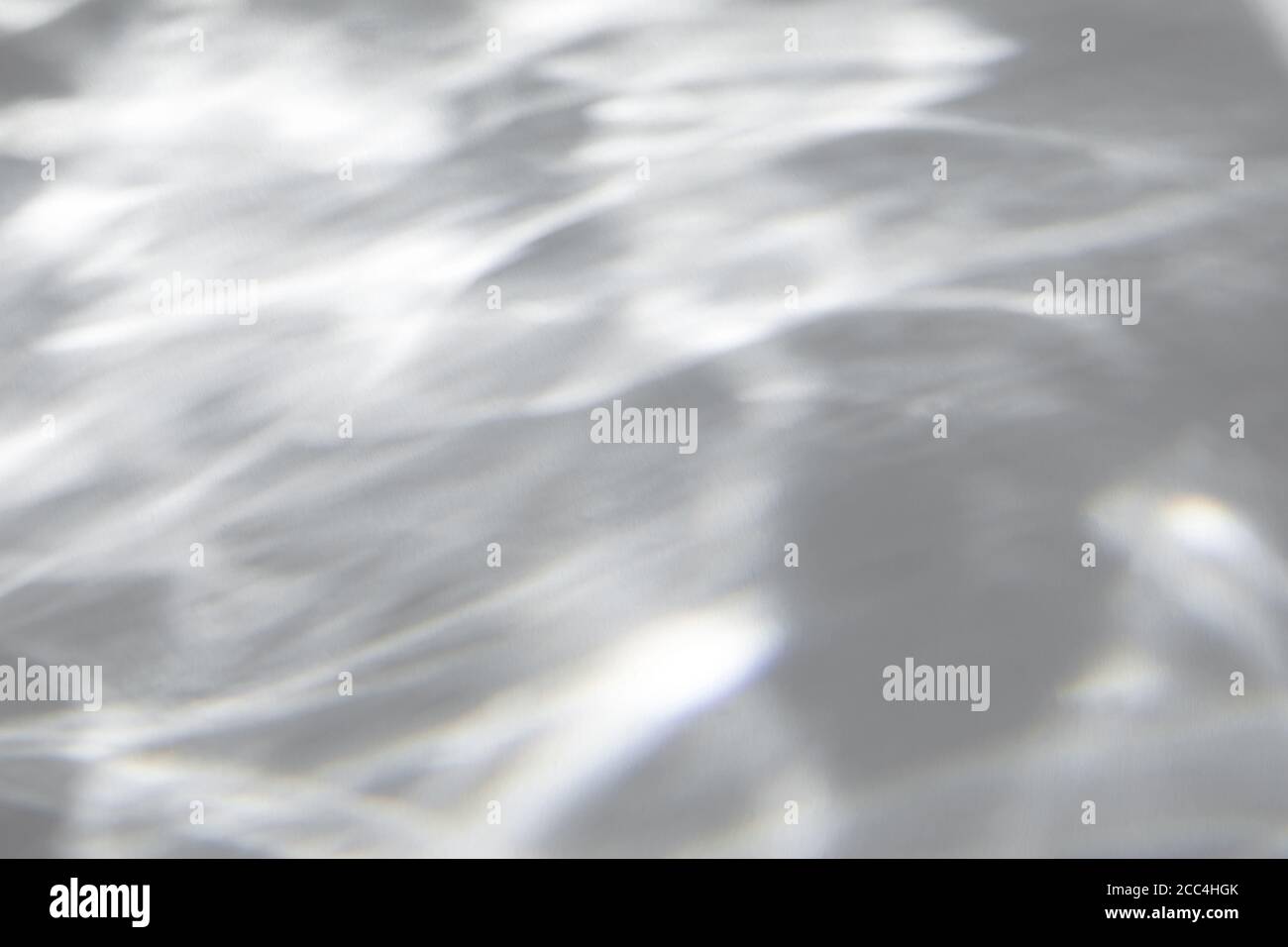 shadow and light caustic effect on a white wall Stock Photo - Alamy