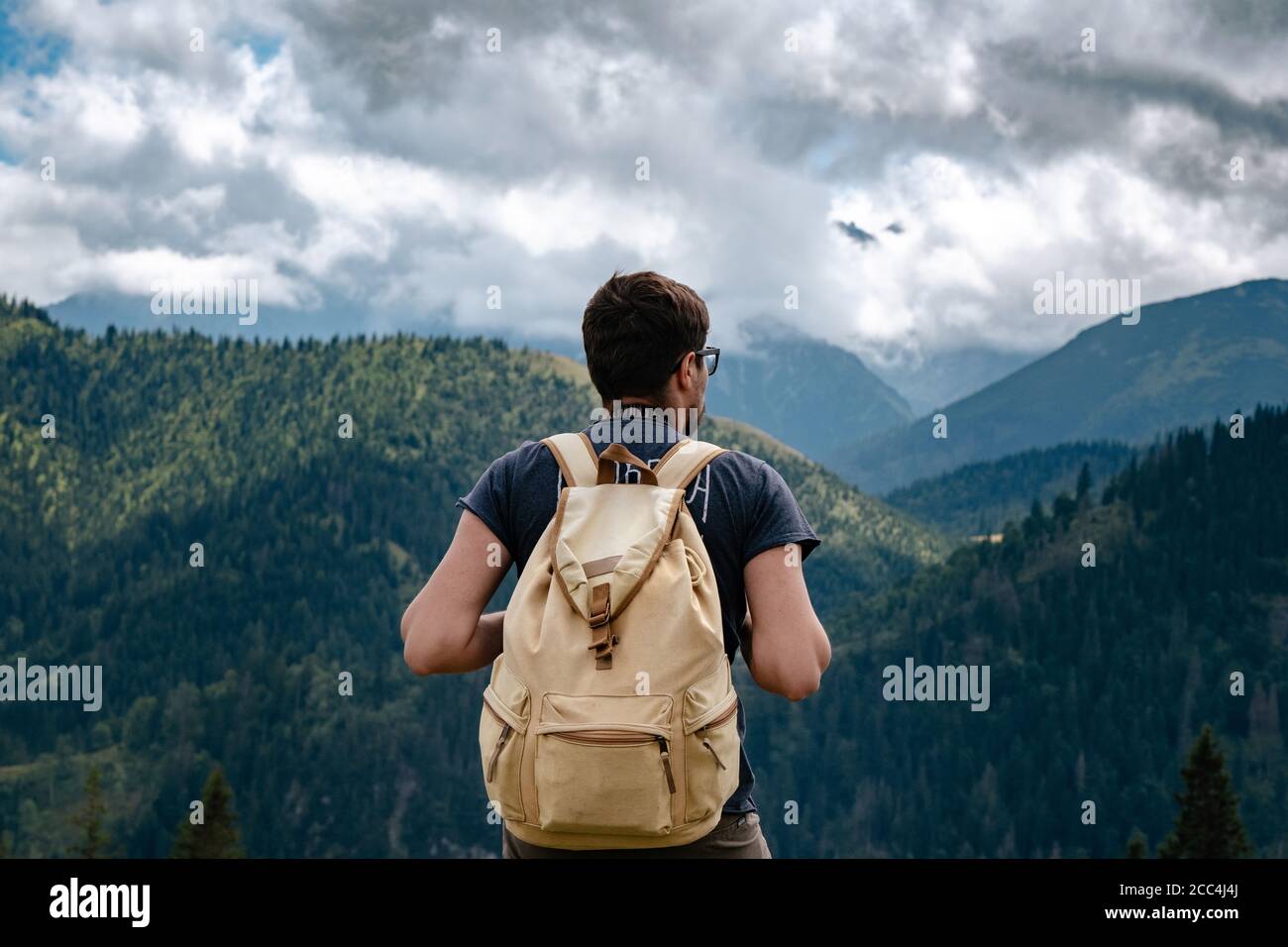 Man hiking at mountains with heavy backpack Travel Lifestyle wanderlust ...