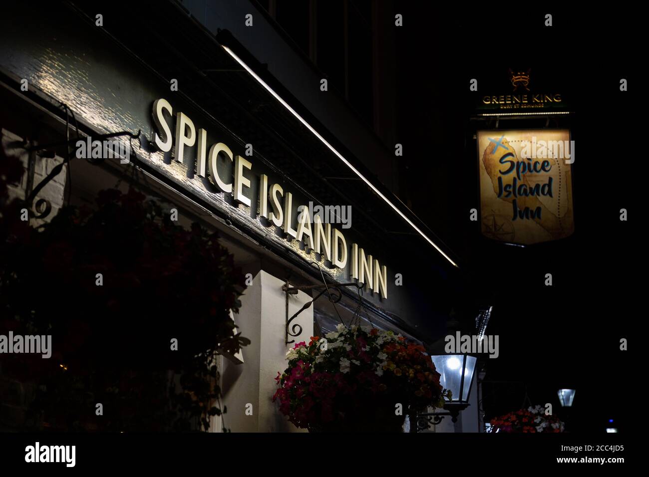 The sign of the The Spice island inn old Portsmouth at night Stock ...