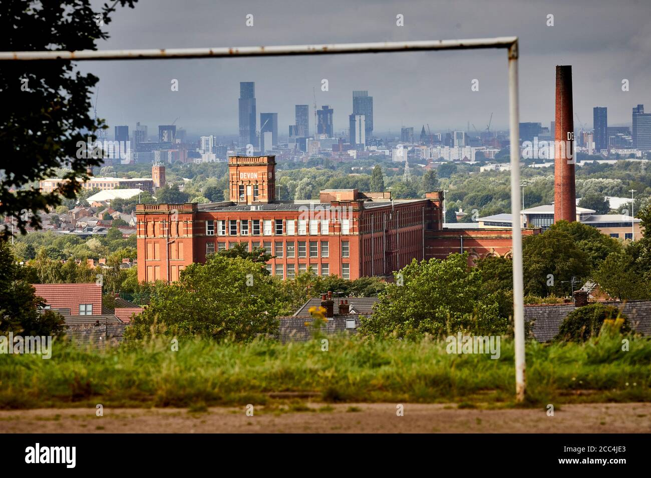 Grade II listed large red brick textile Devon Mill in Oldham with the ...
