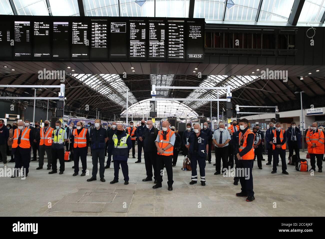 Members of the public join rail staff as they stand in Glasgow Queen ...