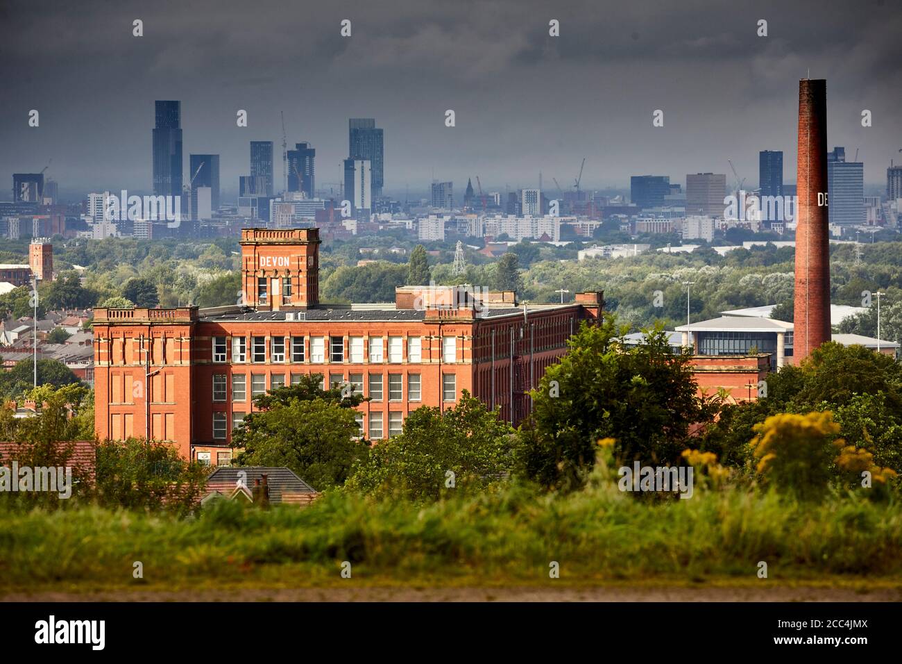 Grade II listed large red brick textile Devon Mill in Oldham with the ...