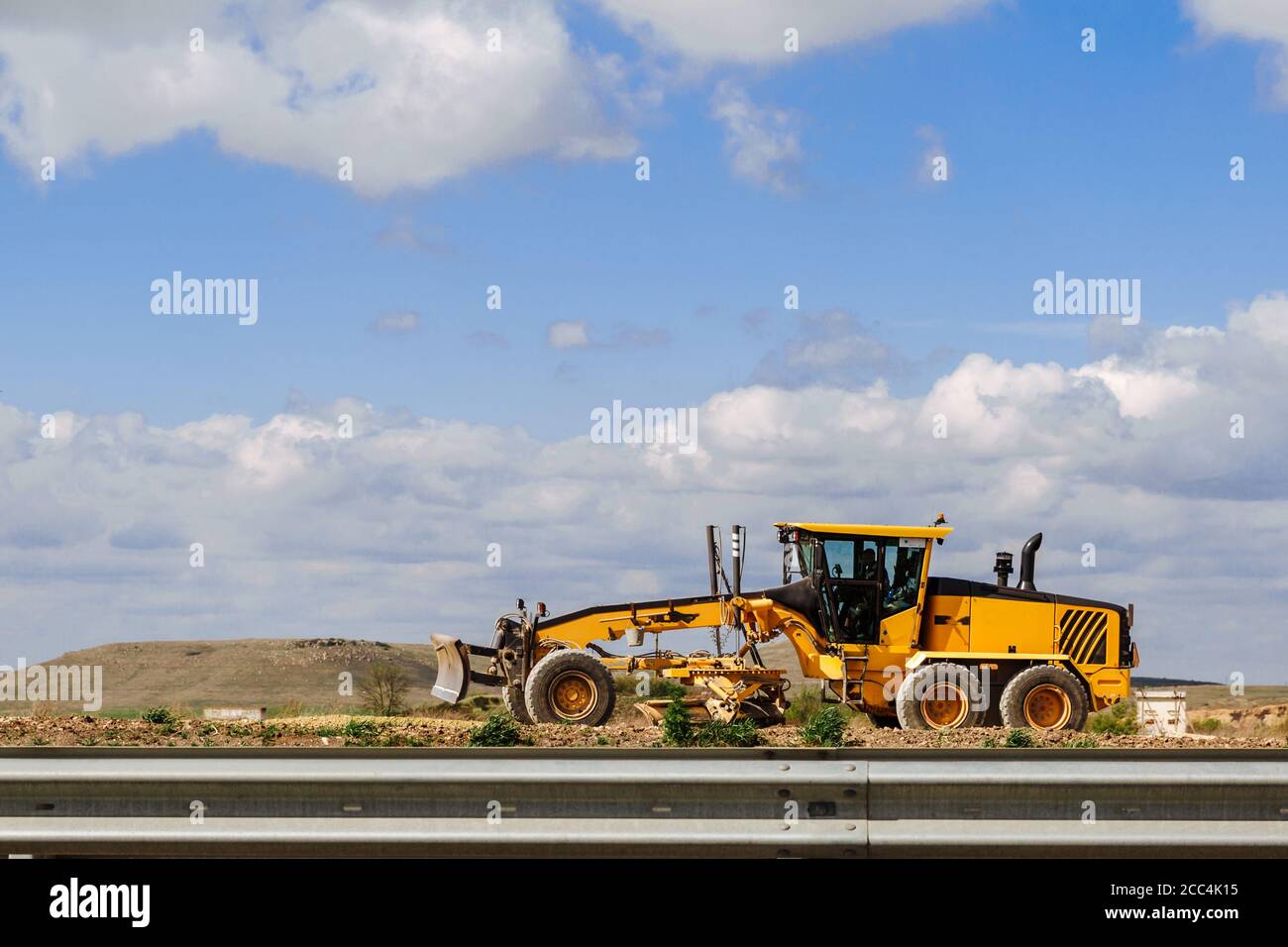 Grader yellow. Grader road construction, industrial machine for the ... Grader yellow. Grader road construction, industrial machine for the ...