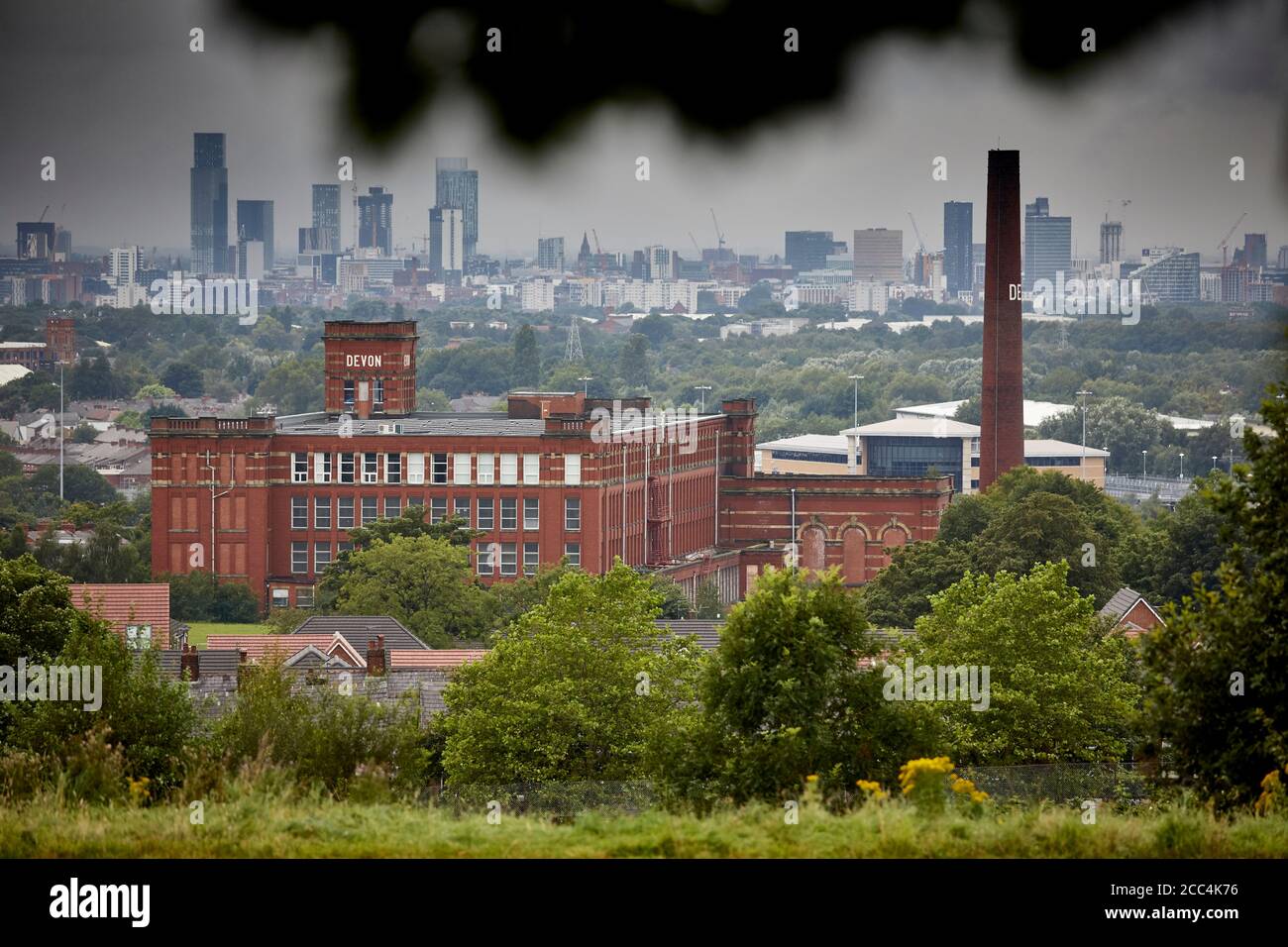 Grade II listed large red brick textile Devon Mill in Oldham with the ...