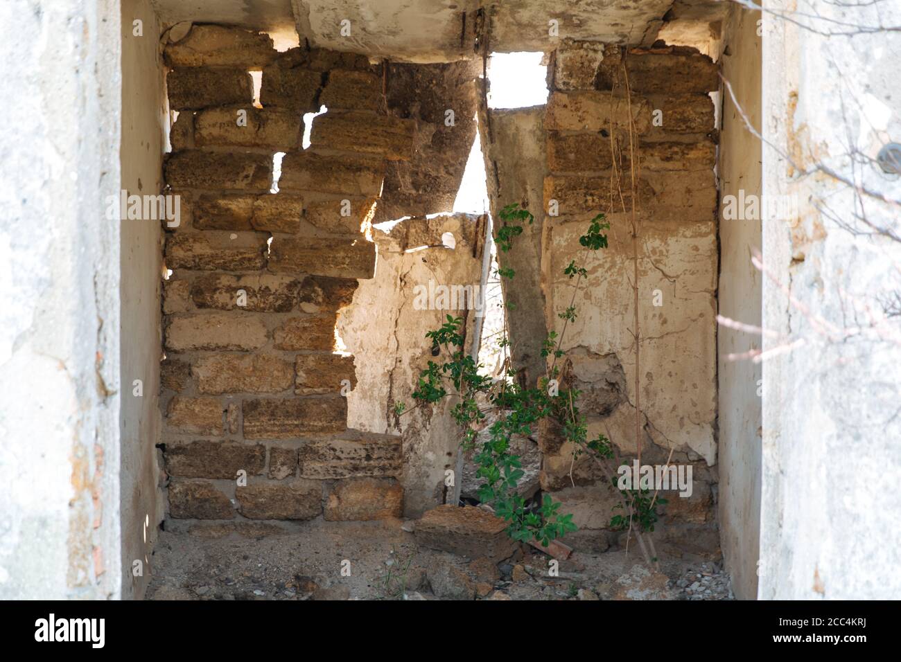 Inside an abandoned old house, uninhabitable. The wall collapsed. An ...