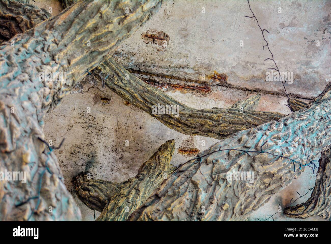 Clumsy artificial tree supports roof like decorative pillar ...