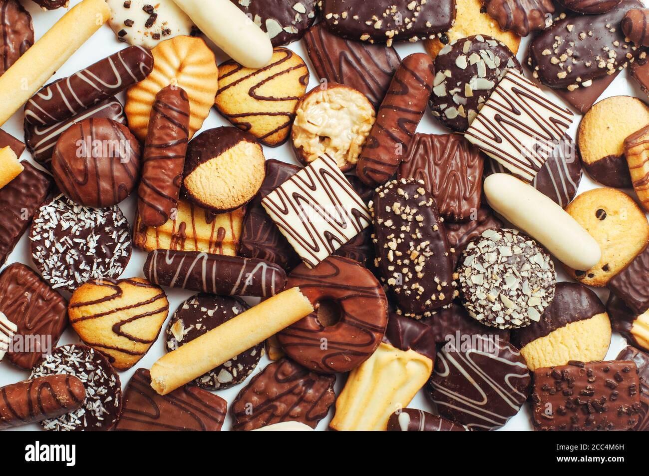 Assortment of mixed biscuits covered with milk, dark and white ...