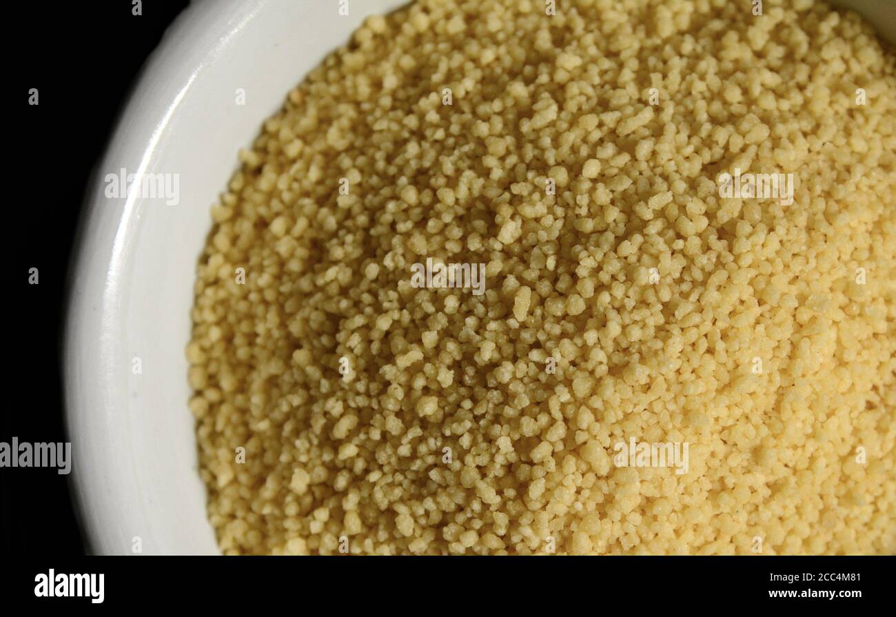 Uncooked couscous in ceramic bowl hi-res stock photography and images ...