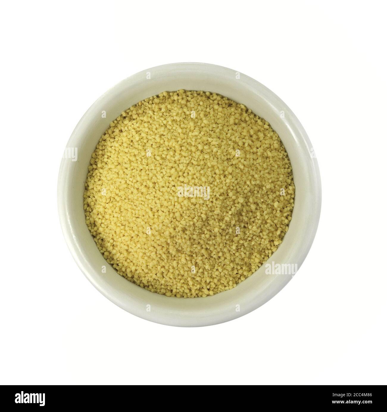 Dry couscous in white ceramic bowl isolated on white Stock Photo - Alamy