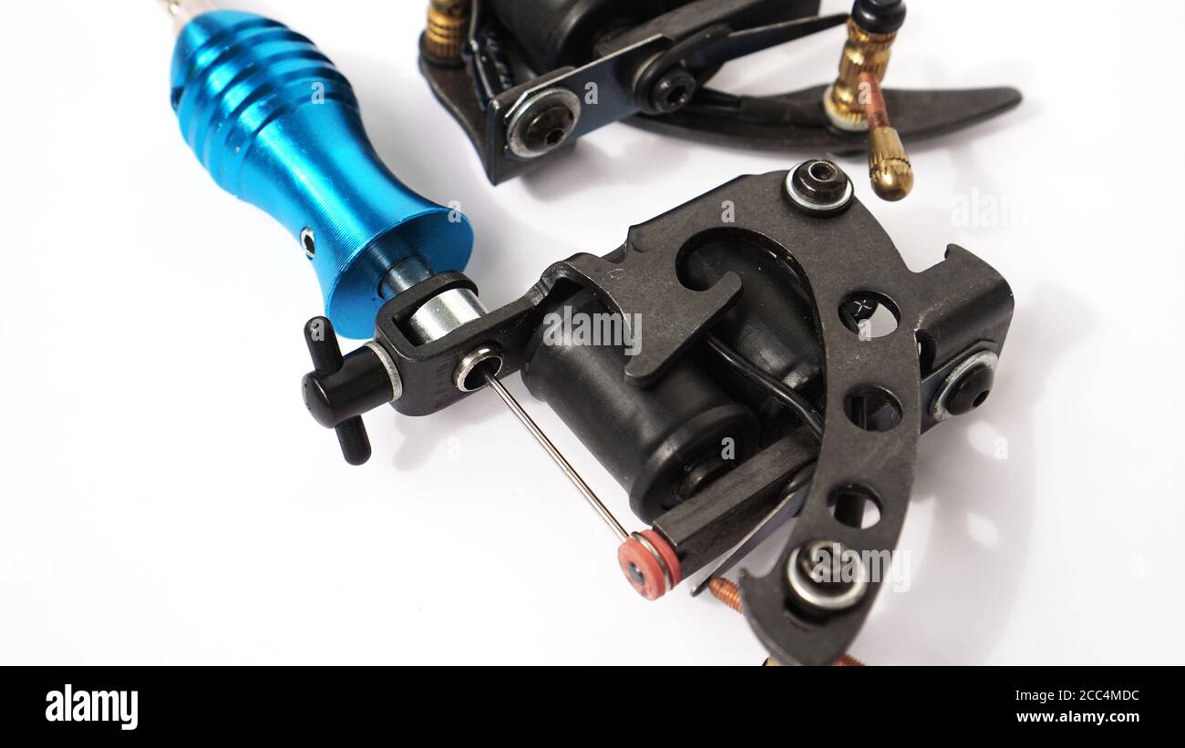 Two tattoo machines on a white background - tattoo industry Stock Photo ...