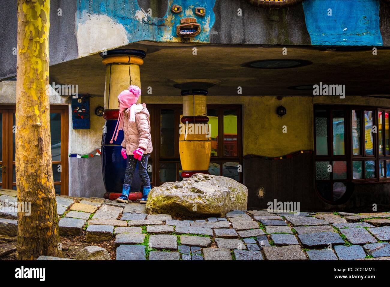 little girl in pink clothes exploring in front of a magical creepy ...