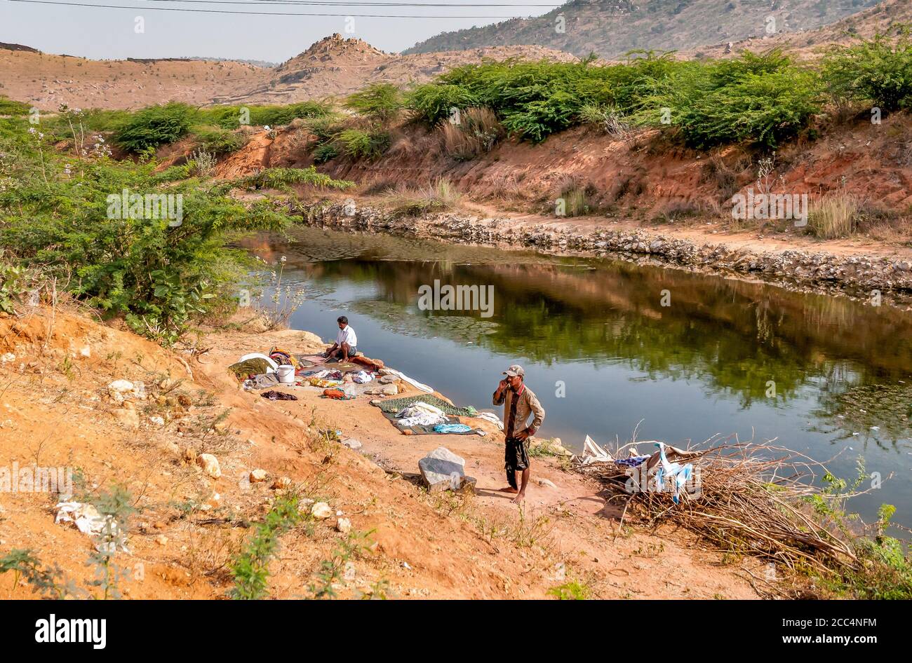 Indian man washing clothes hi-res stock photography and images - Alamy