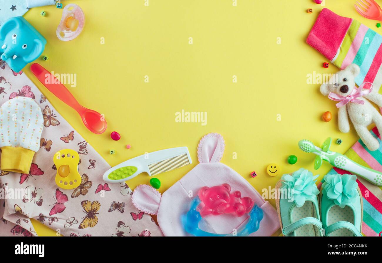 Baby shower party background with clothes, shoes, accessories and ...