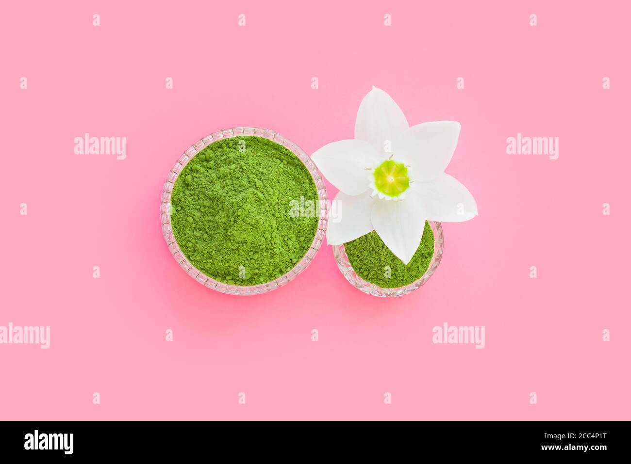 matcha dry green powder on a pink background for making Japanese ...
