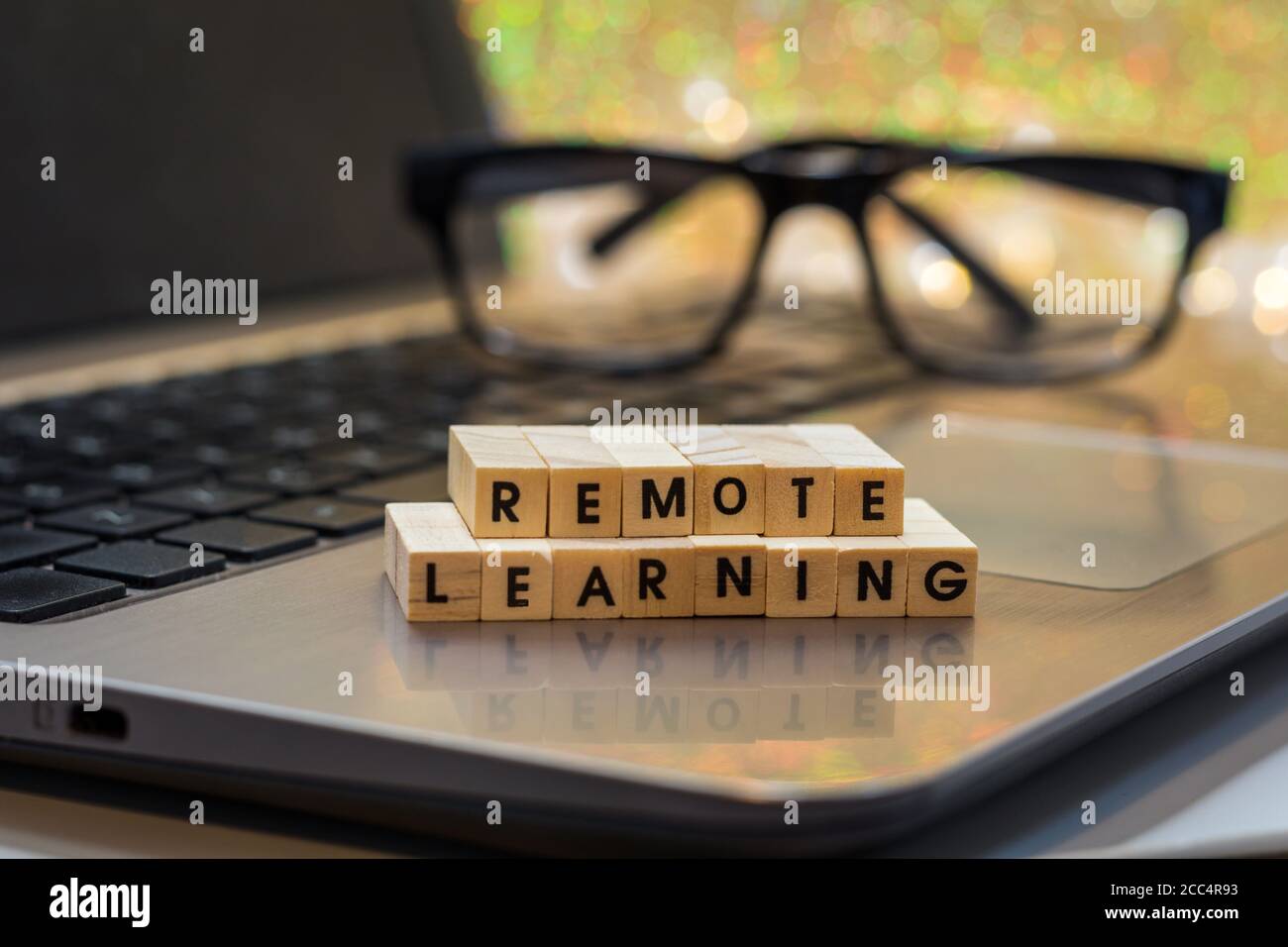 REMOTE LEARNING virtual learning concept with wood block letters on ...
