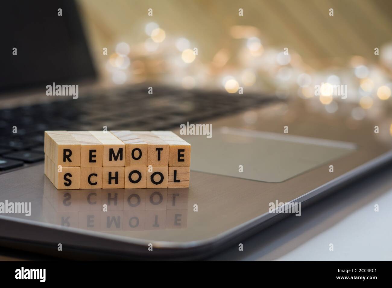REMOTE SCHOOL virtual learning concept with wood block letters on ...