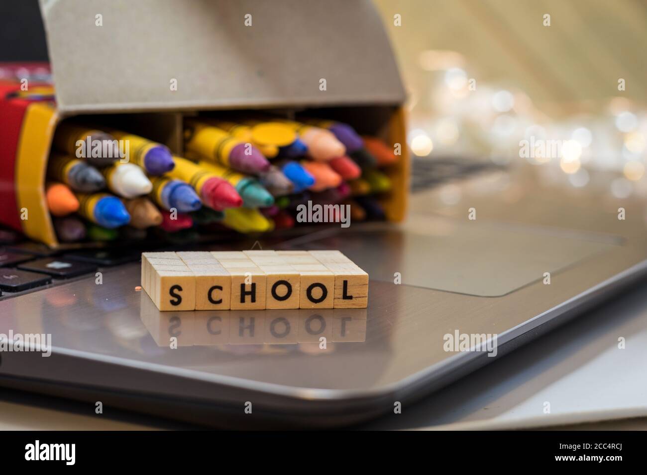 SCHOOL virtual learning concept with wood block letters on laptop ...