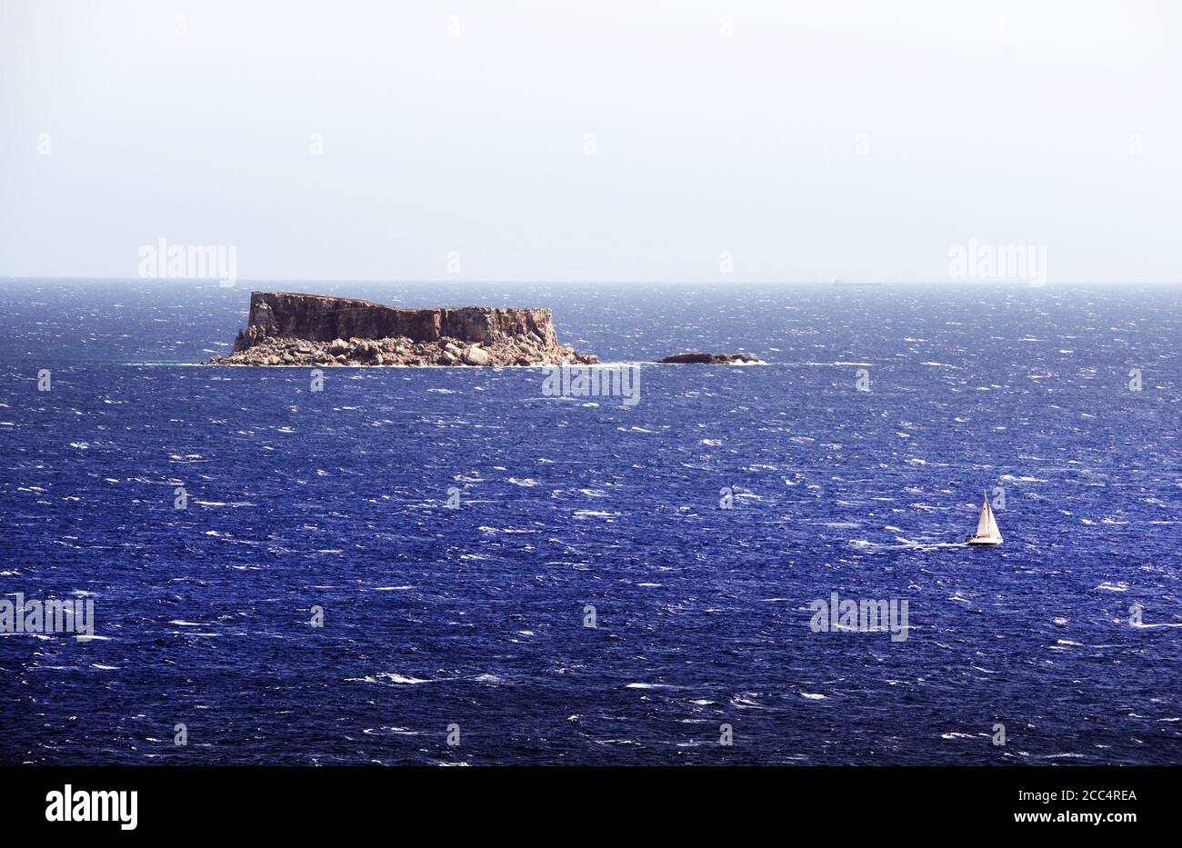 Sailing by Filfla island in Malta Stock Photo - Alamy