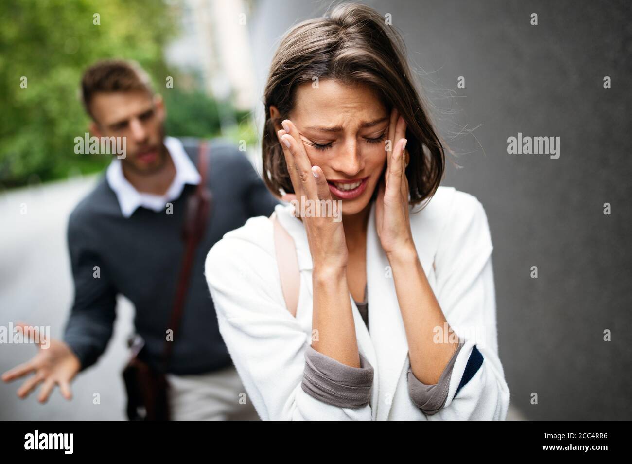 Woman sad man street hi-res stock photography and images - Alamy