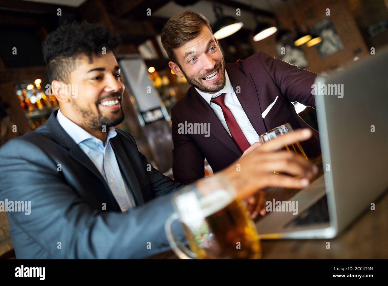 Business people drink beer after work. Businessmen enjoy a beer Stock ...