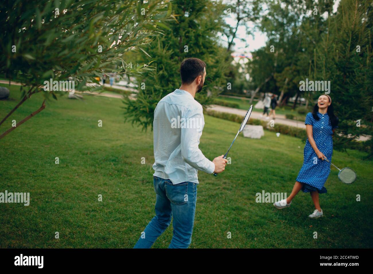Playing badminton in park hi-res stock photography and images - Alamy