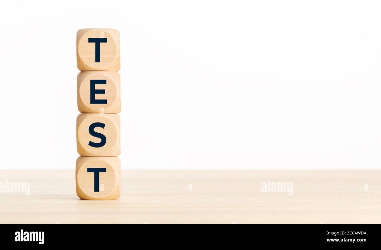 Test concept. Wooden blocks with text on desk. Copy space Stock Photo ...