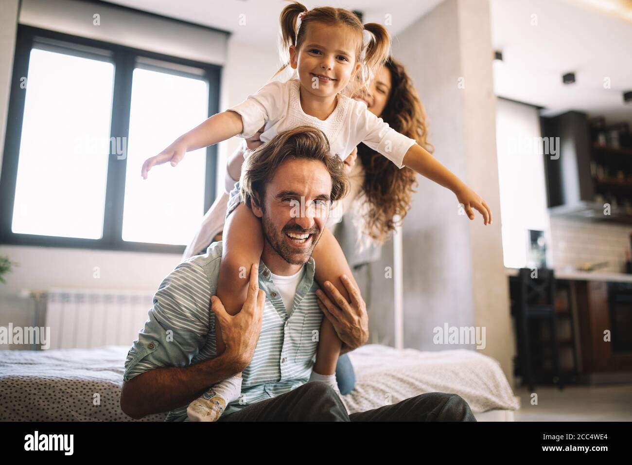 Happy family having fun times at home Stock Photo - Alamy
